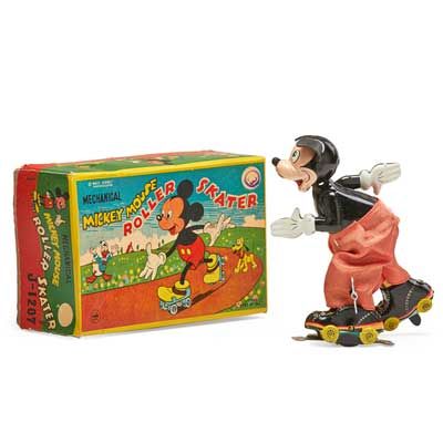 Realized price for Mickey mouse tin toy; roller